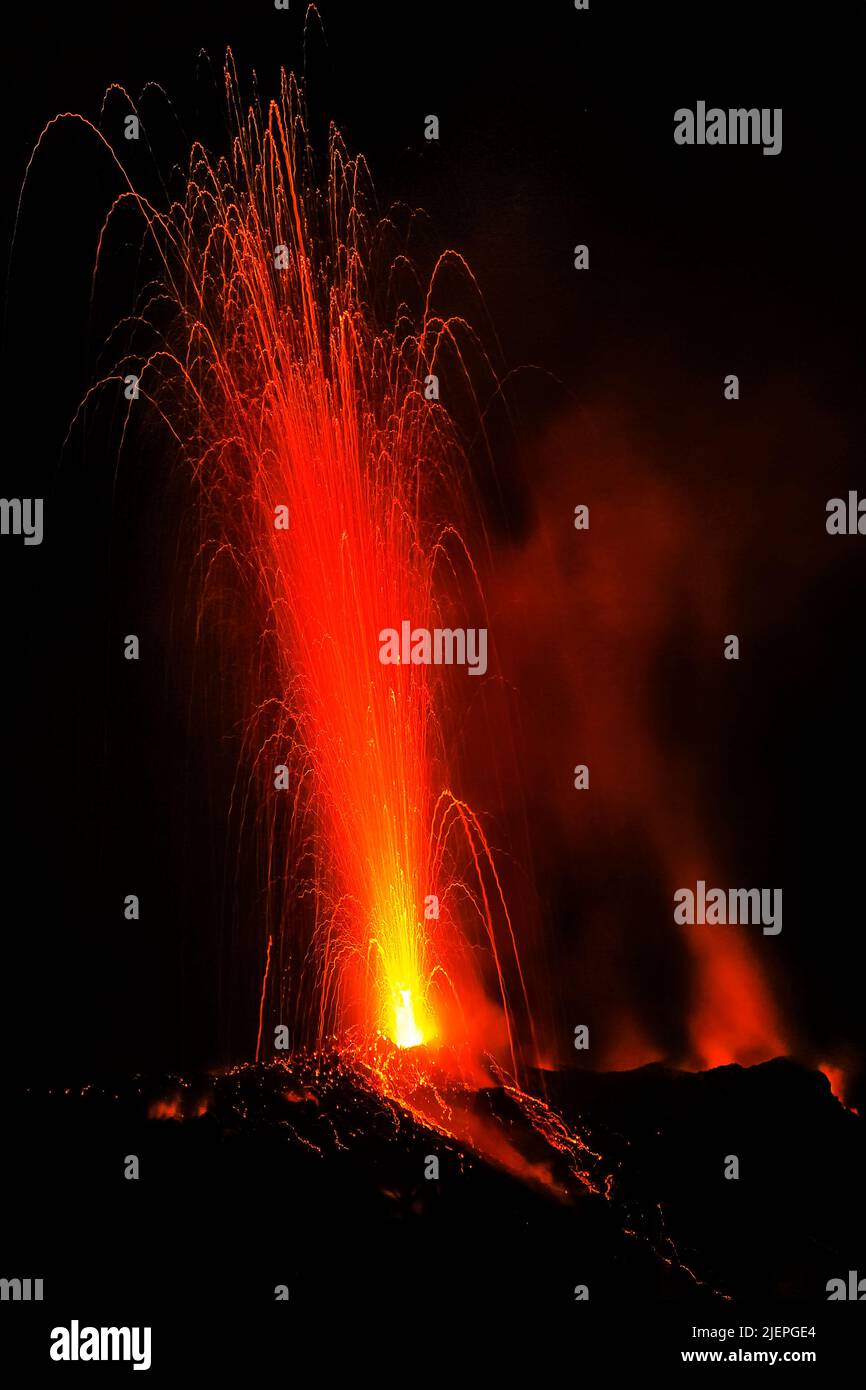 Lava bombs erupt from multiple vents at this volcano at night. This ...