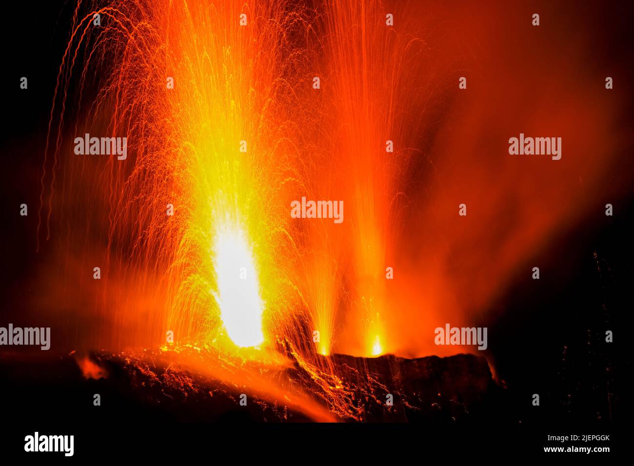 Lava bombs erupt from multiple vents at this volcano at night. This ...
