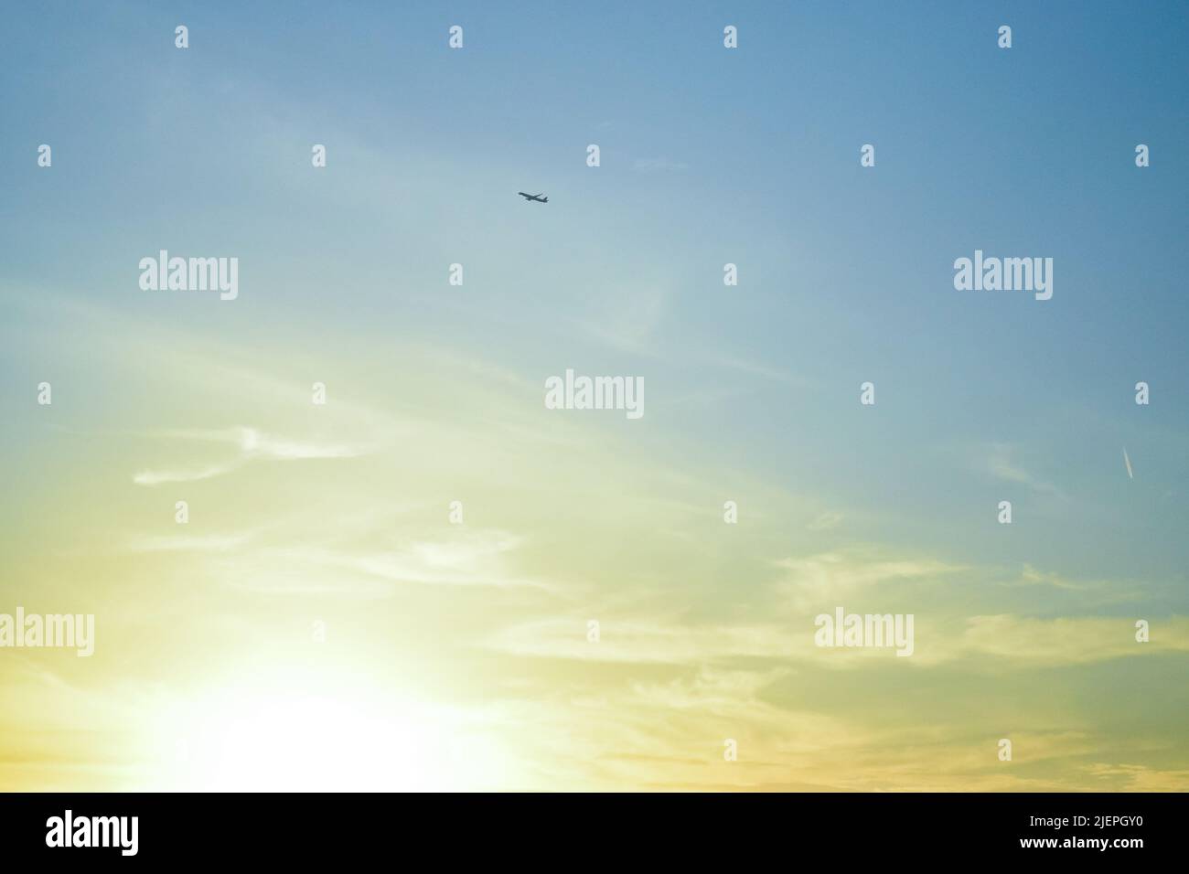 Sunset Sky Plane Fly Stock Photo - Alamy