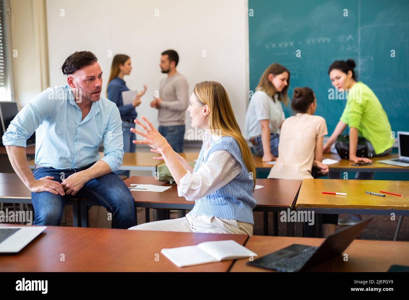 Positive students communicating during recess between lectures in ...