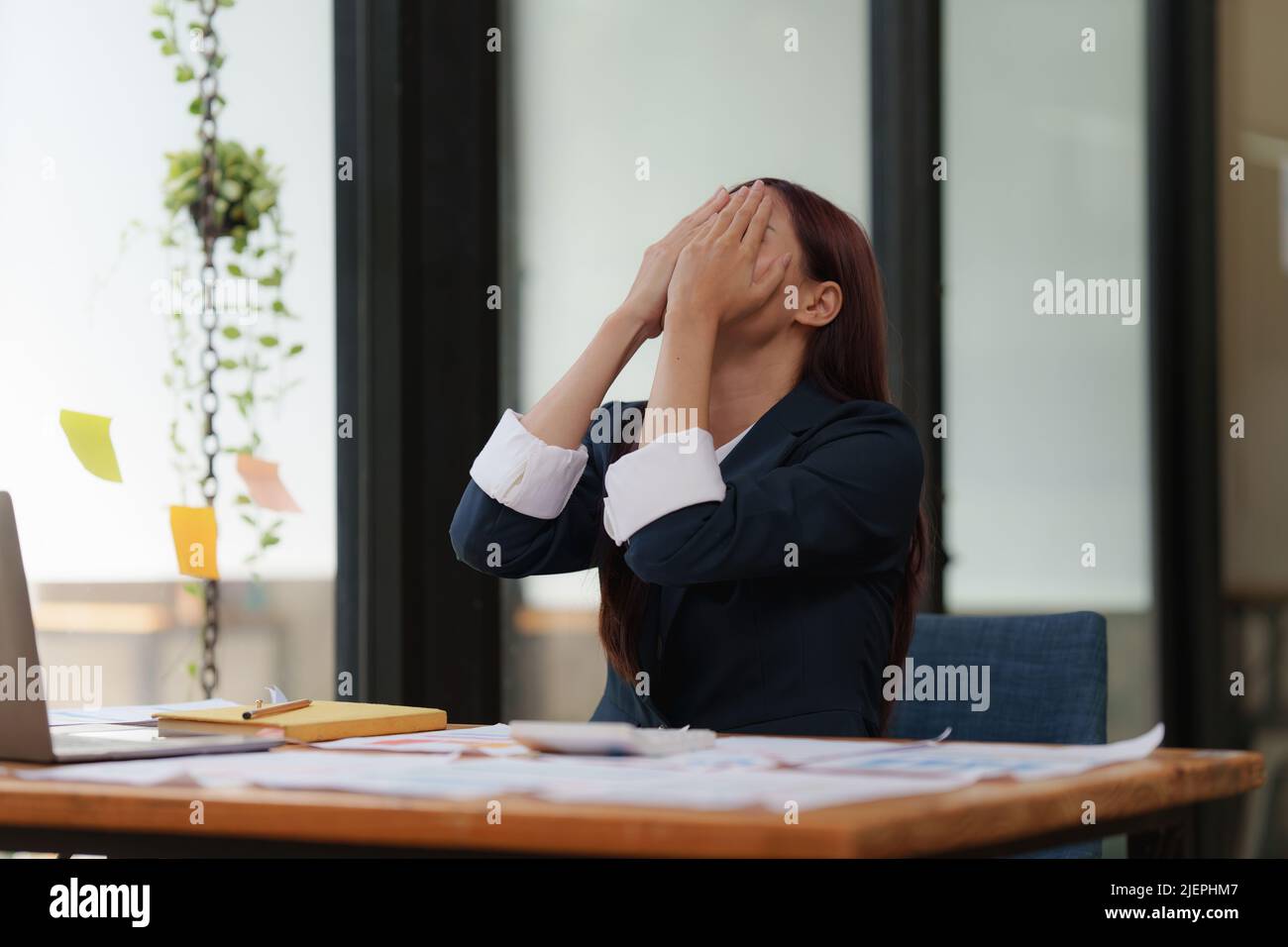 Asian business woman worry about marketing plan of this years. Account ...