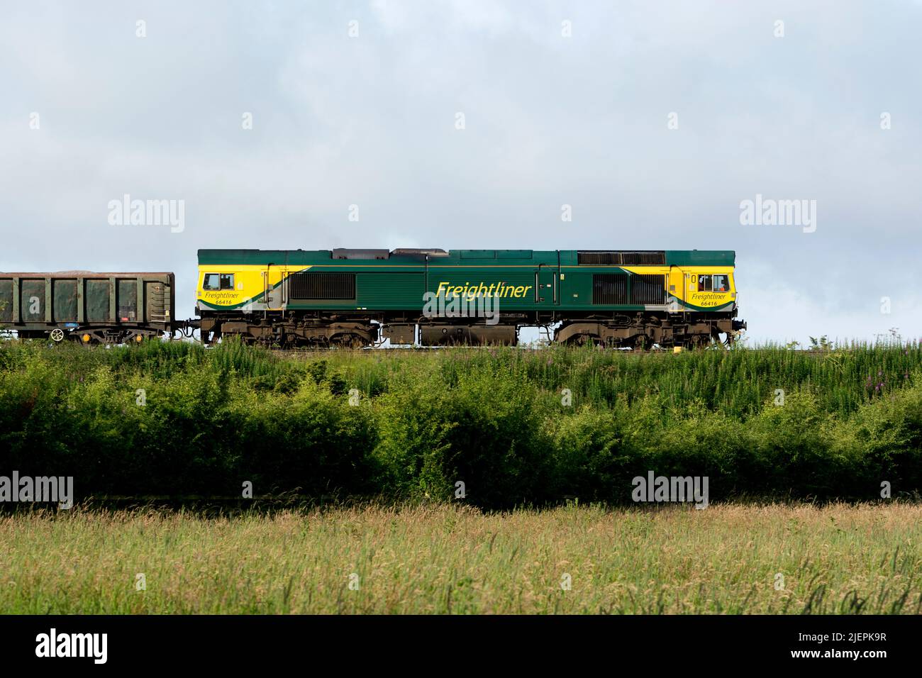 Freightliner class 66 diesel locomotive No. 66416 pulling a stone train ...