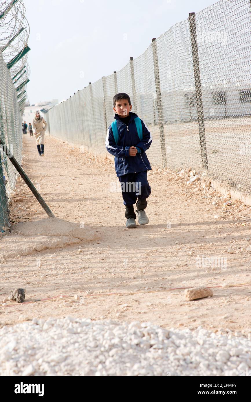 Al Za'atari. Jordan. Primary School Student (Boy) walking home towards ...