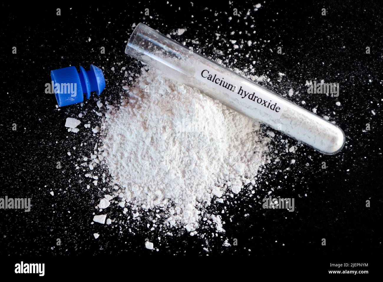 Calcium hydroxide in test tube and black background Stock Photo - Alamy