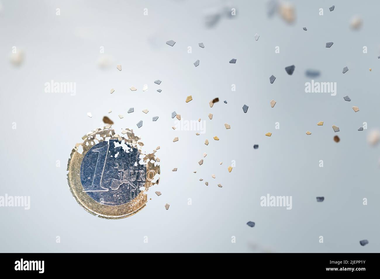1 Euro coin breaking into pieces Stock Photo - Alamy
