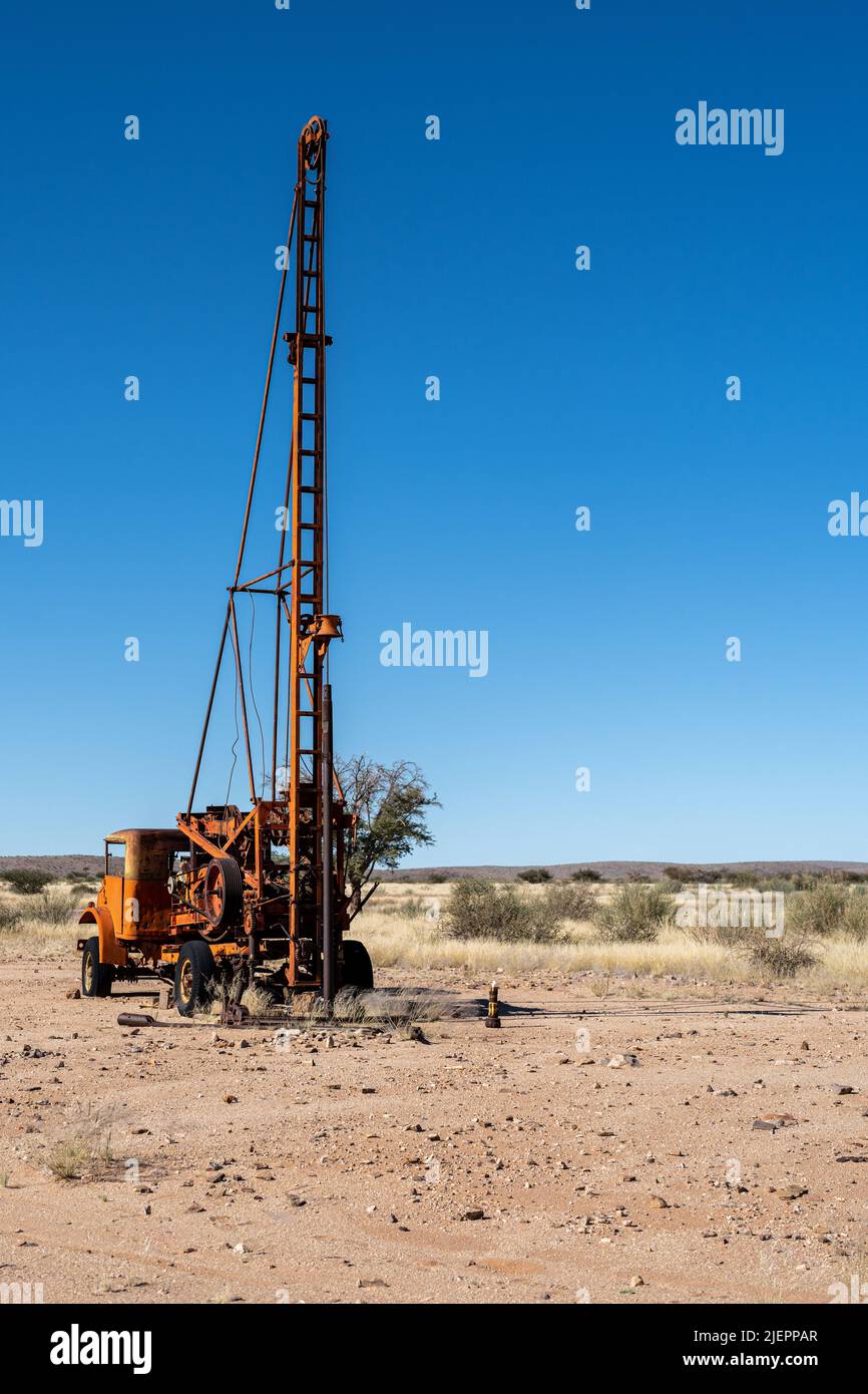 An old and abandoned drilling machine vehicle in the desert Stock Photo ...
