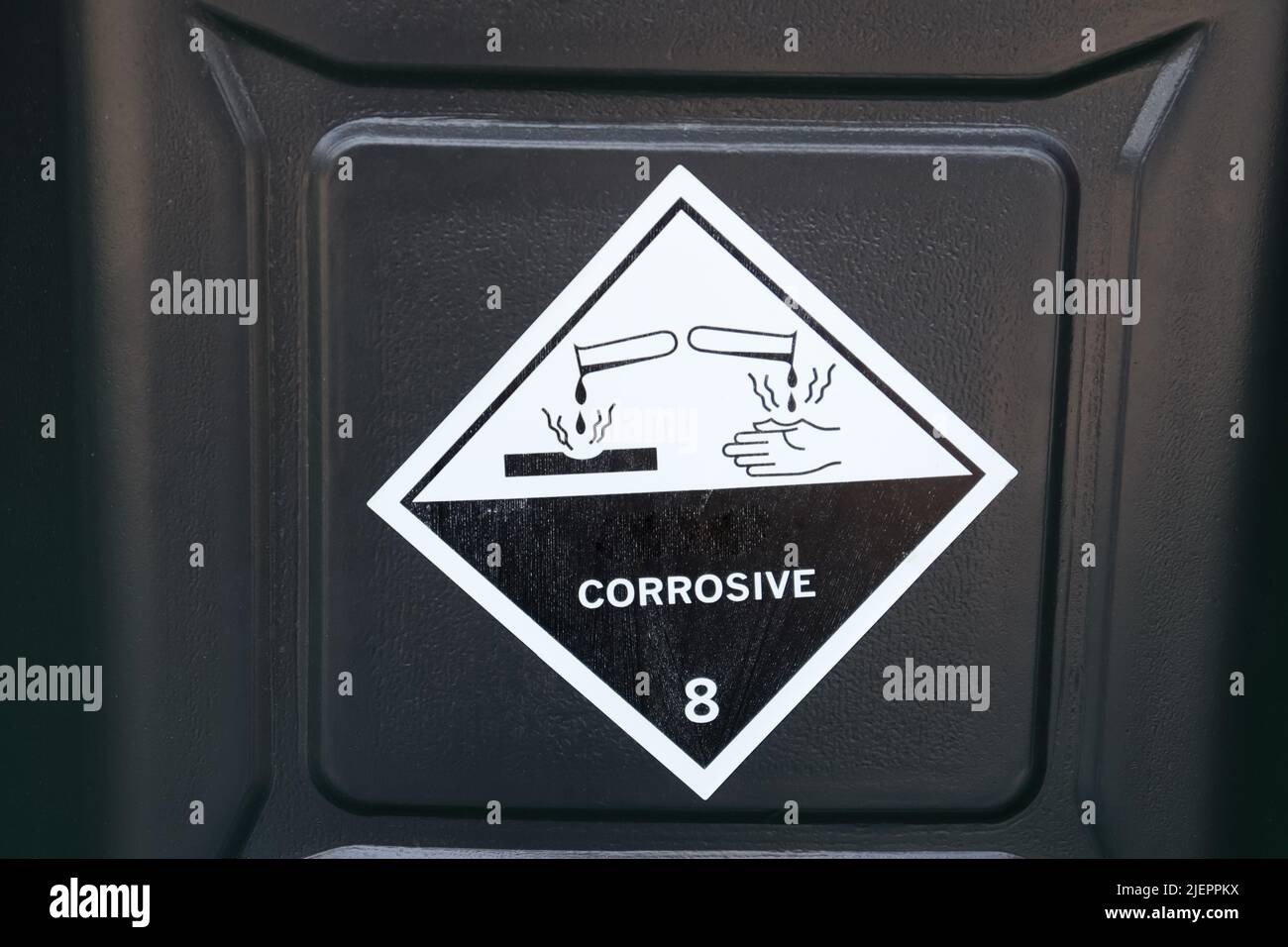 Corrosive chemical symbols on a black chemical tank Stock Photo - Alamy