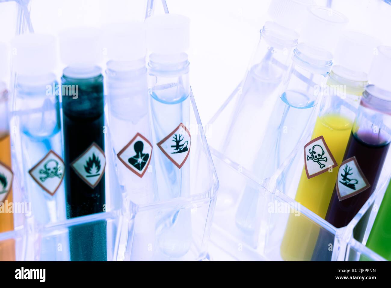 Chemicals in test tubes and symbols used in laboratory or industry ...