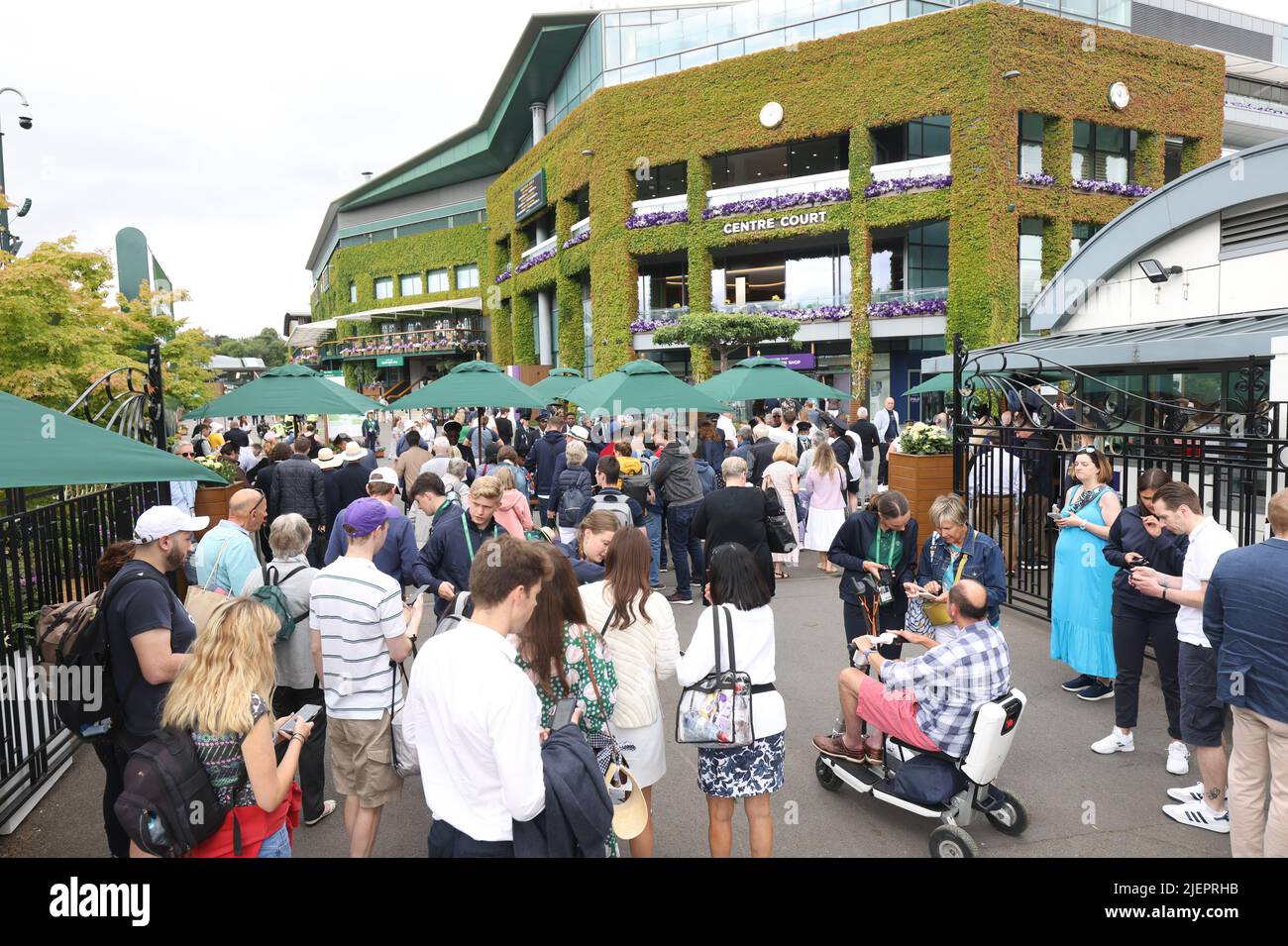 Members of the public scan their tickets before entering Wimbledon ...