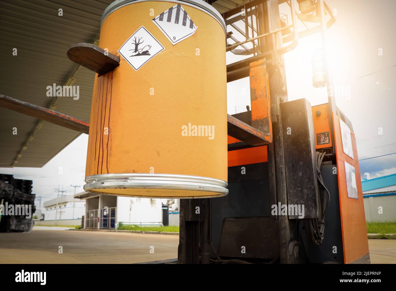 A forklift accident hits a dangerous chemical tank in factory Stock ...