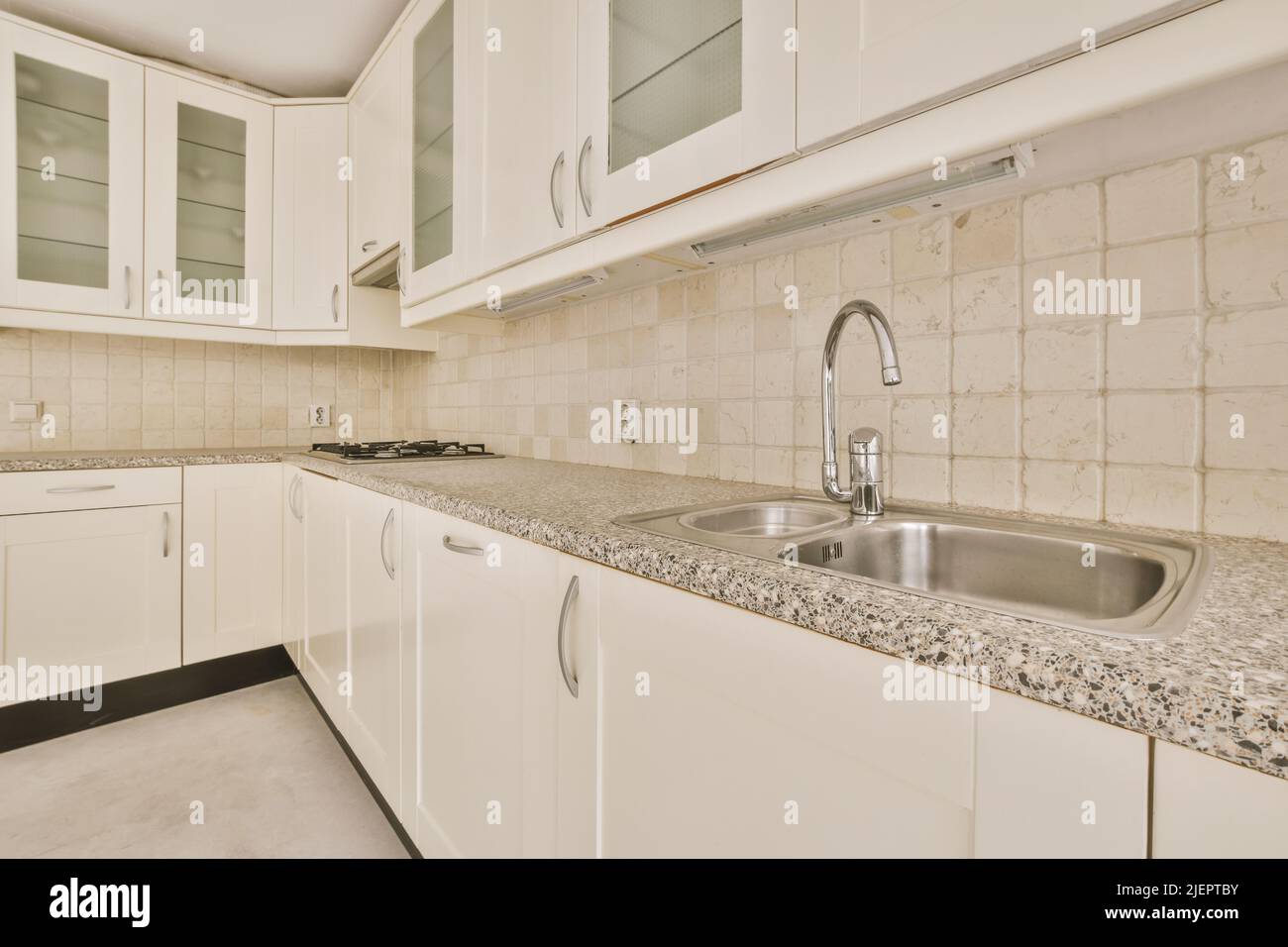 Interior of empty white kitchen with windows and wooden parquet floor ...