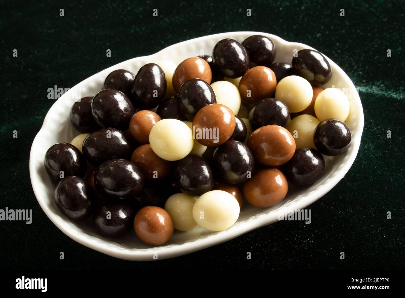 Chocolate covered hazelnuts. Chocolate balls Stock Photo - Alamy