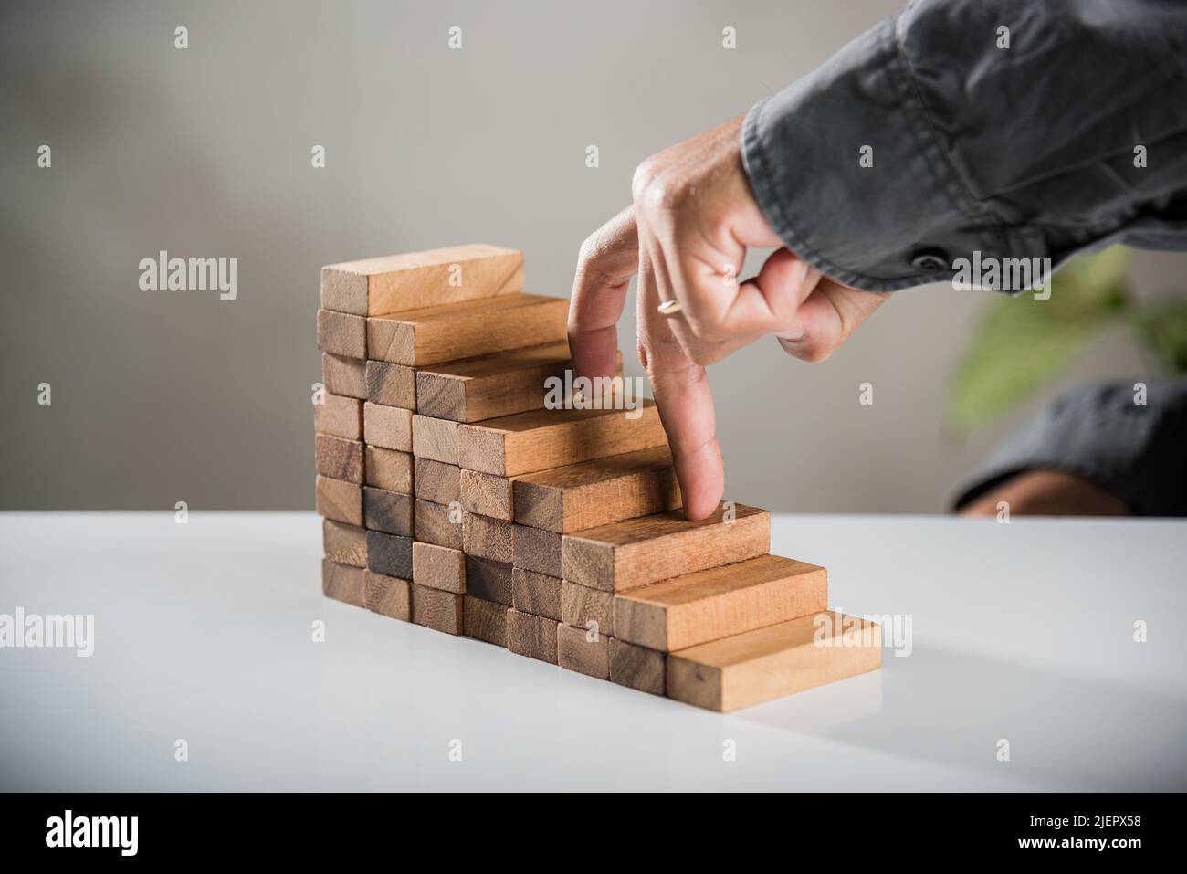 Business two finger symbol walking up on wood blocks shape staircase to ...