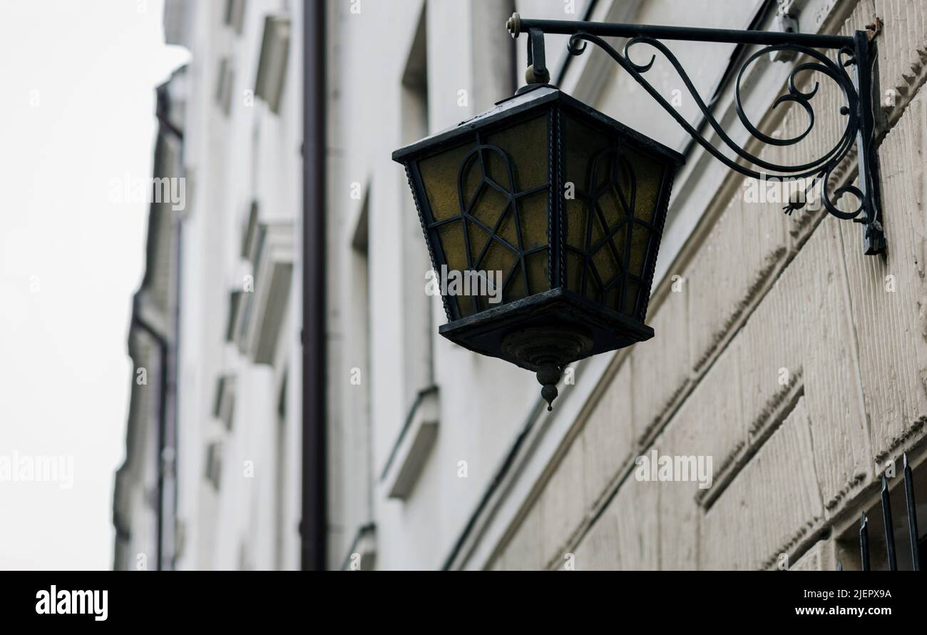 old street lantern hangs on building. vintage lamp Stock Photo - Alamy
