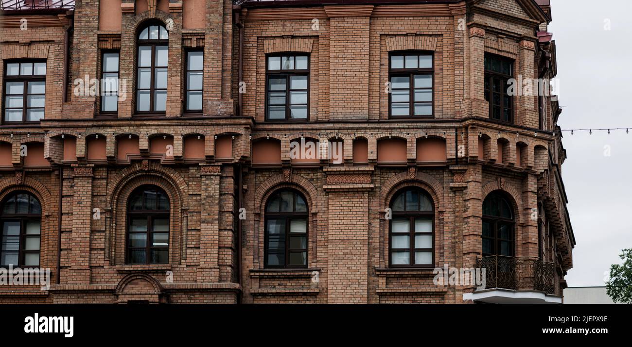 old brick house with windows. vintage architecture in English style ...