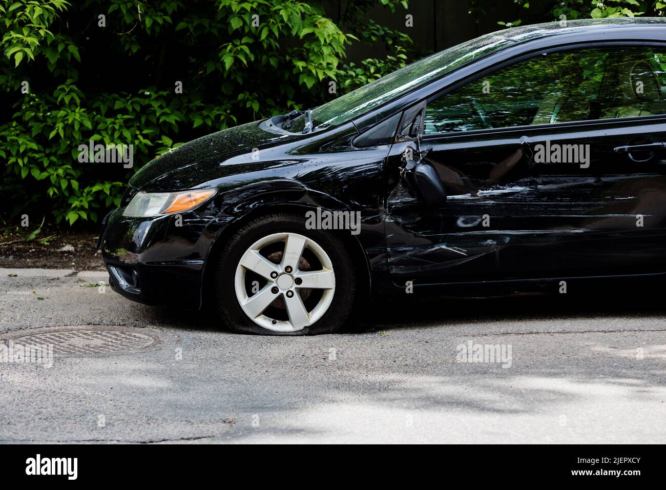 Car punctured hi-res stock photography and images - Alamy