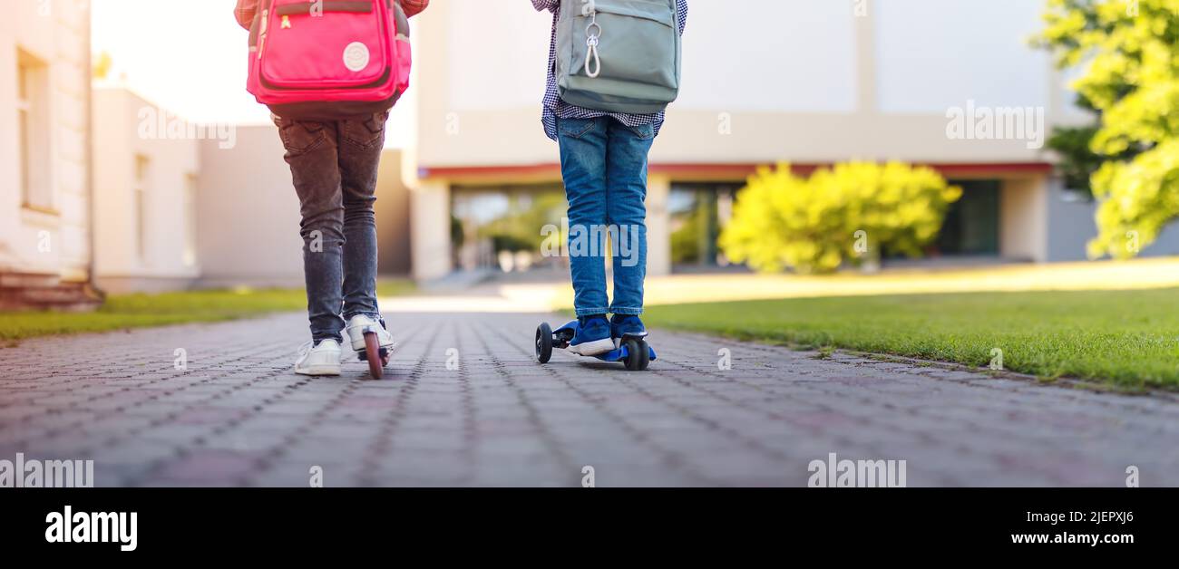 Boy girl scooter hi-res stock photography and images - Alamy