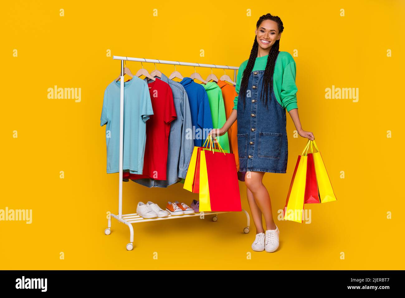 Full body portrait of cheerful charming person hold packages choose ...