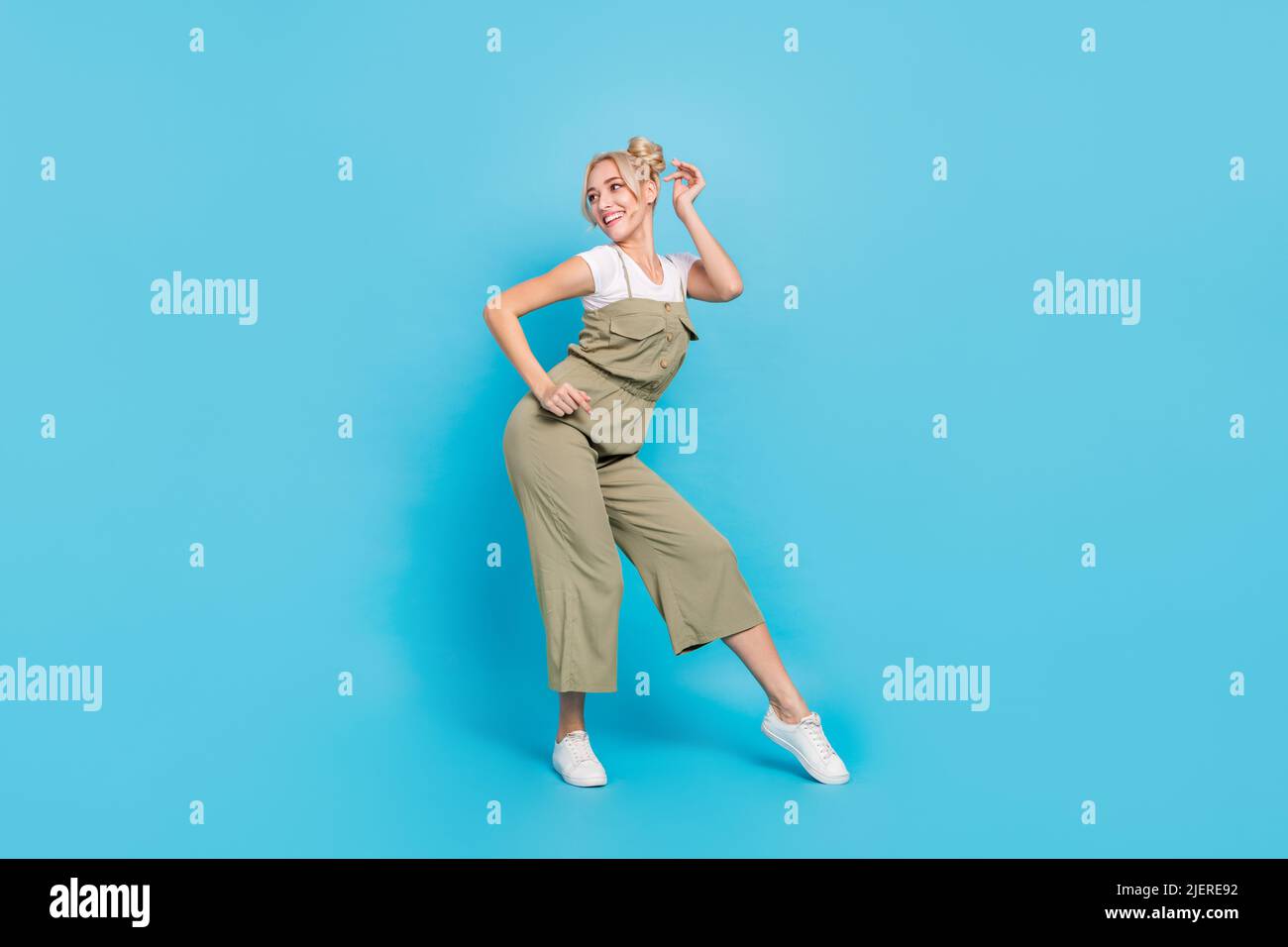 Full body photo of funky blond lady dance wear t-shirt overall sneakers ...