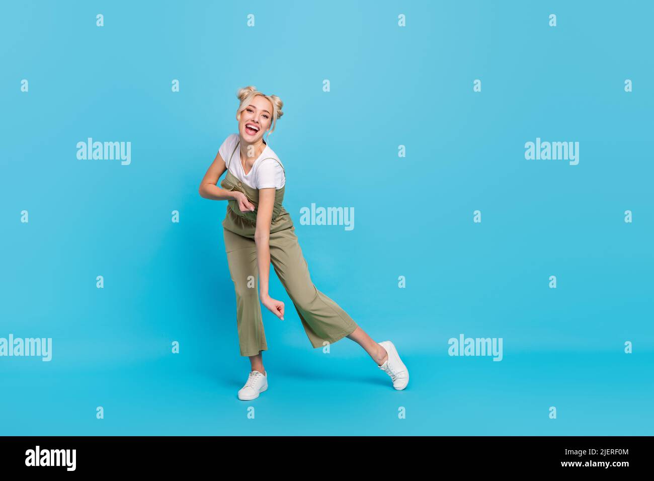 Full size photo of optimistic blond lady dance wear t-shirt overall ...