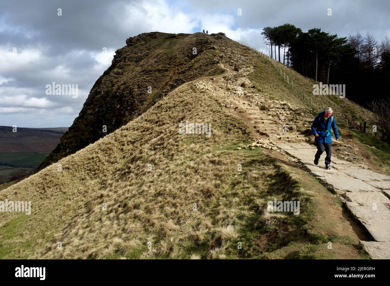 Man Walking on Stone Flags on the Ridge Path form 'Black Tor' in Edale ...