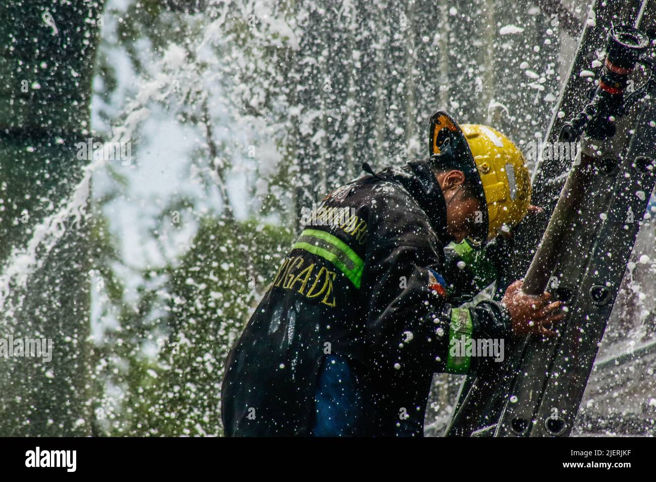 Pasig, Philippines. 28th June, 2022. A firefighter climbs a ladder to ...