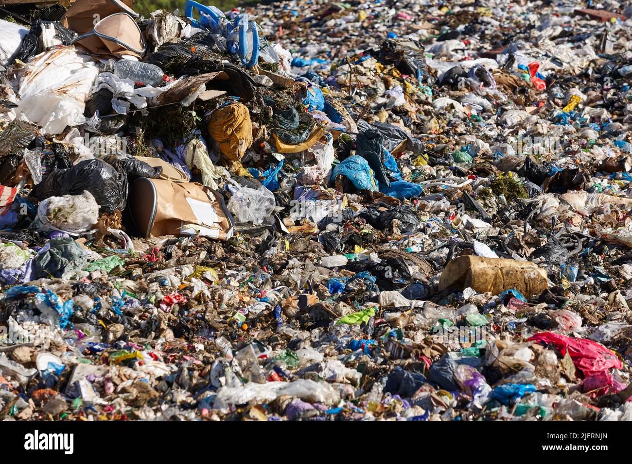 Open air garbage dump. Plastic pollution. Recycling junk. Consumerism ...