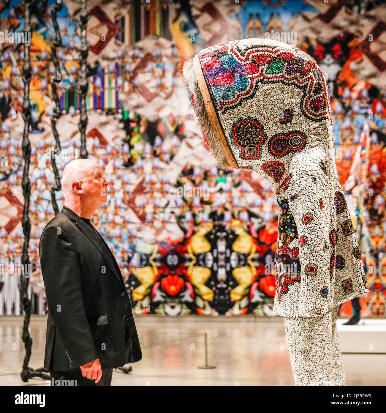 London, UK. 28th June, 2022. Gallery staff with Nick Cave, Soundsuit ...