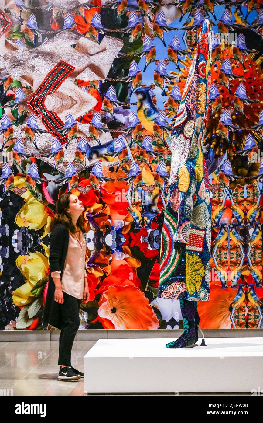 London, UK. 28th June, 2022. Gallery staff with Nick Cave, Soundsuit ...