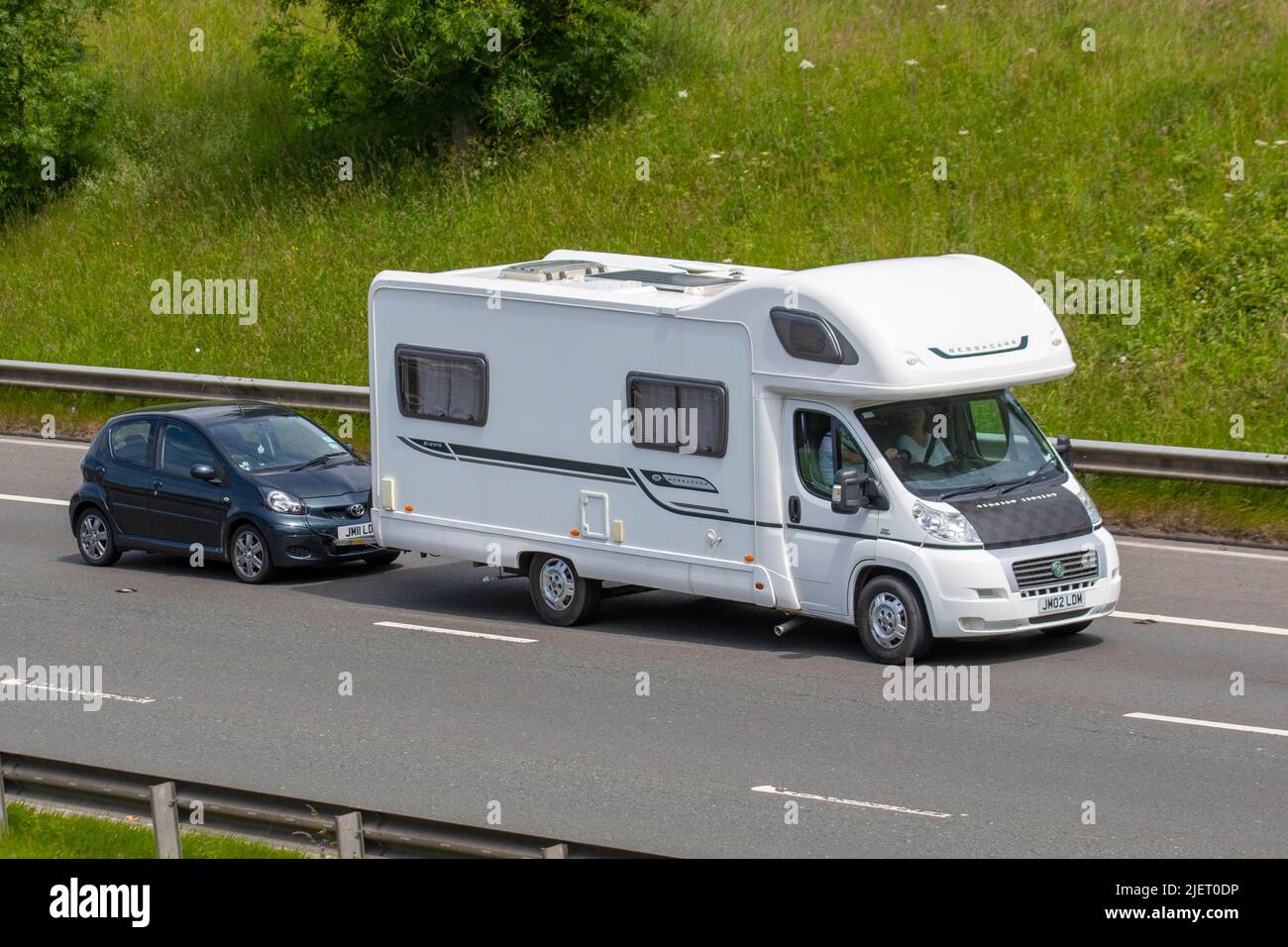 Motorhome towing a vehicle hi-res stock photography and images - Alamy