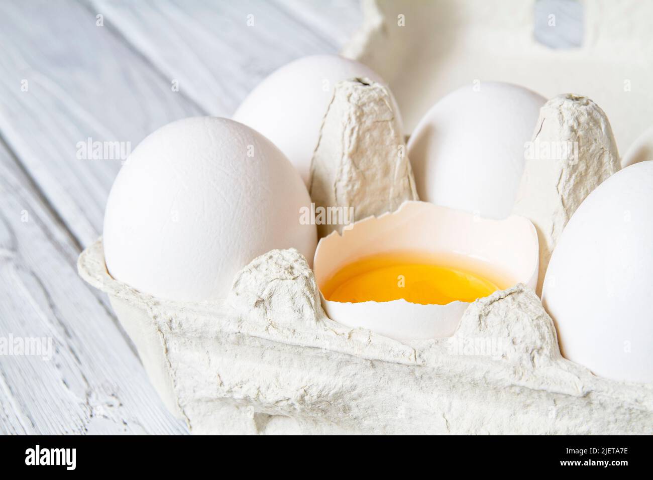Close-up of fresh white organic chicken eggs in the paper tray and egg ...