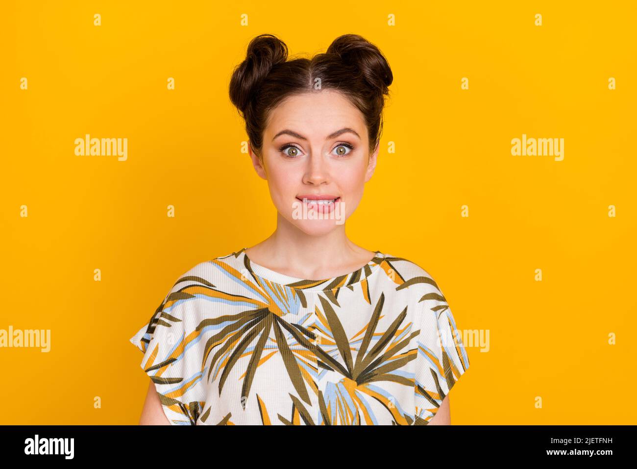 Photo of gorgeous tricky woman wear print t-shirt biting lip smiling ...