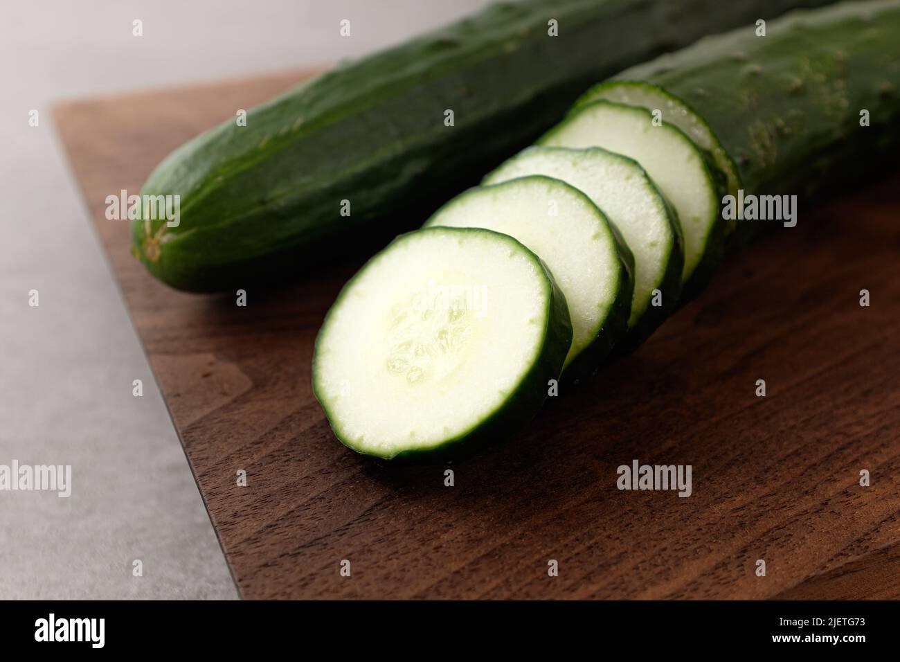 Long and succulent vegetable green cucumber Stock Photo - Alamy