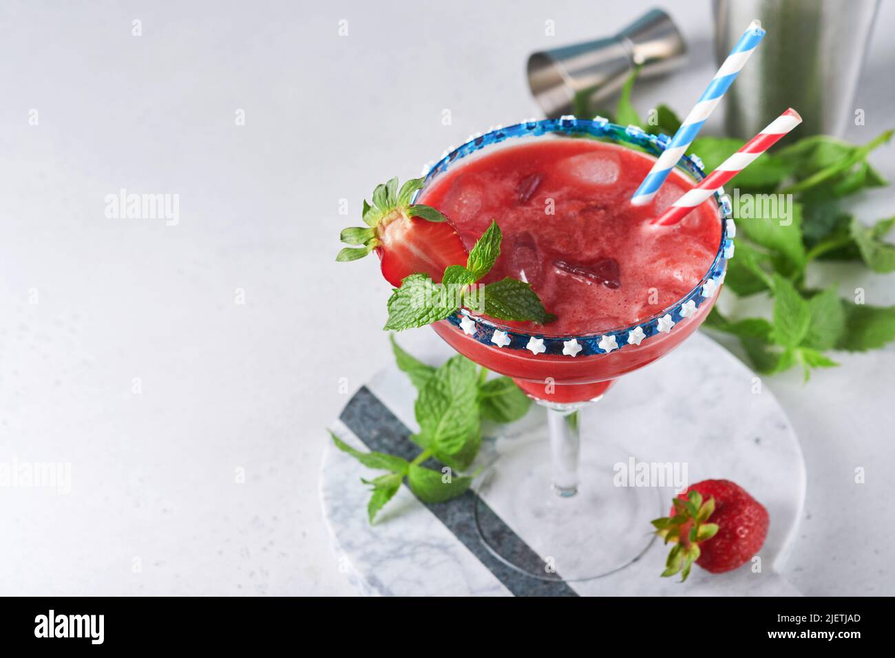 Patriotic Cocktail 4th july. Glass margarita cocktail with strawberry ...