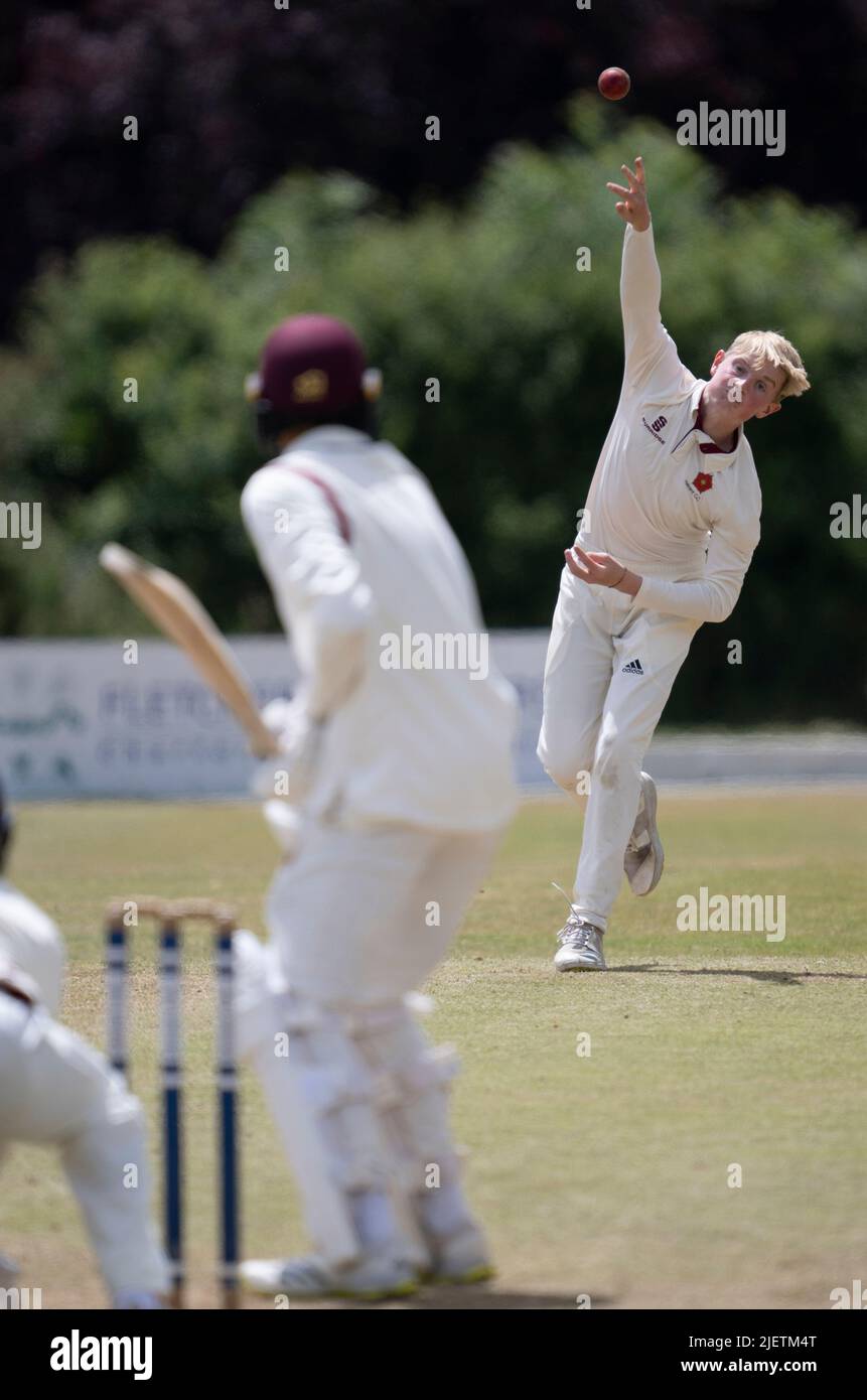 Teenage bowler in action Stock Photo - Alamy