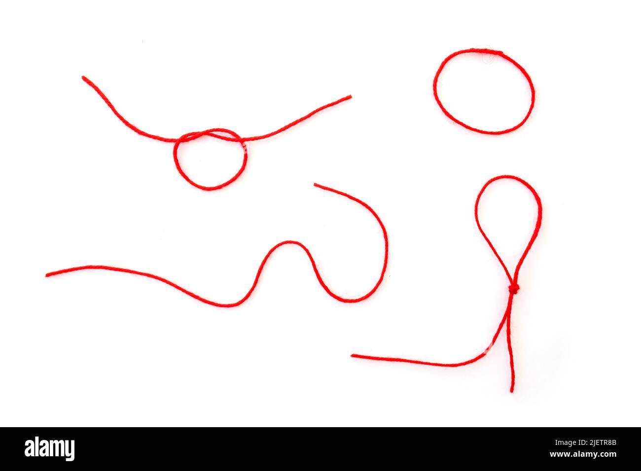 Abstract shapes by woolen red thread, rope isolated on white, top view ...