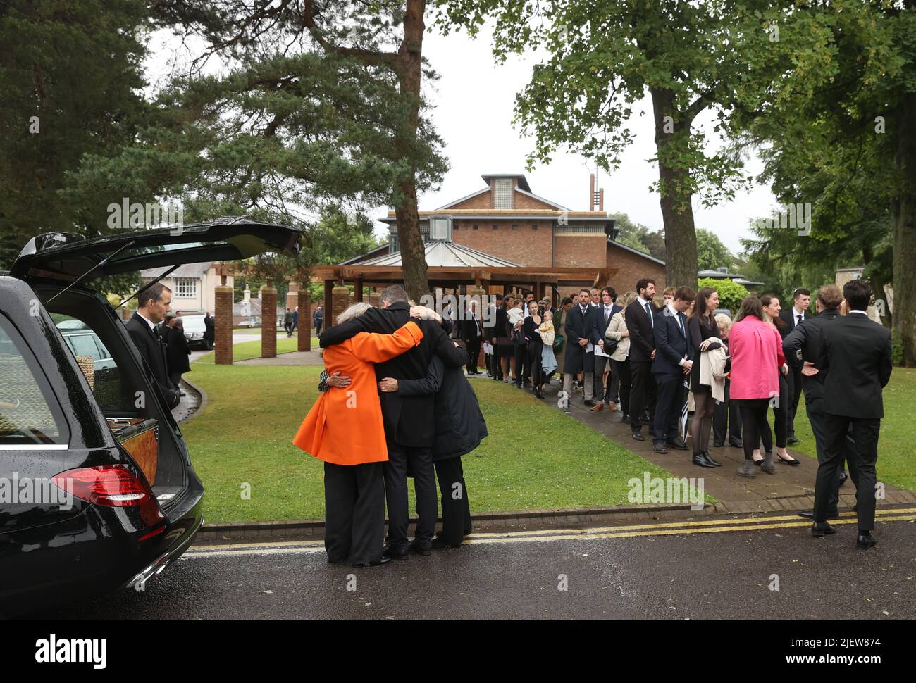 Mourners leaving the funeral of long-time owner of the Irish News ...