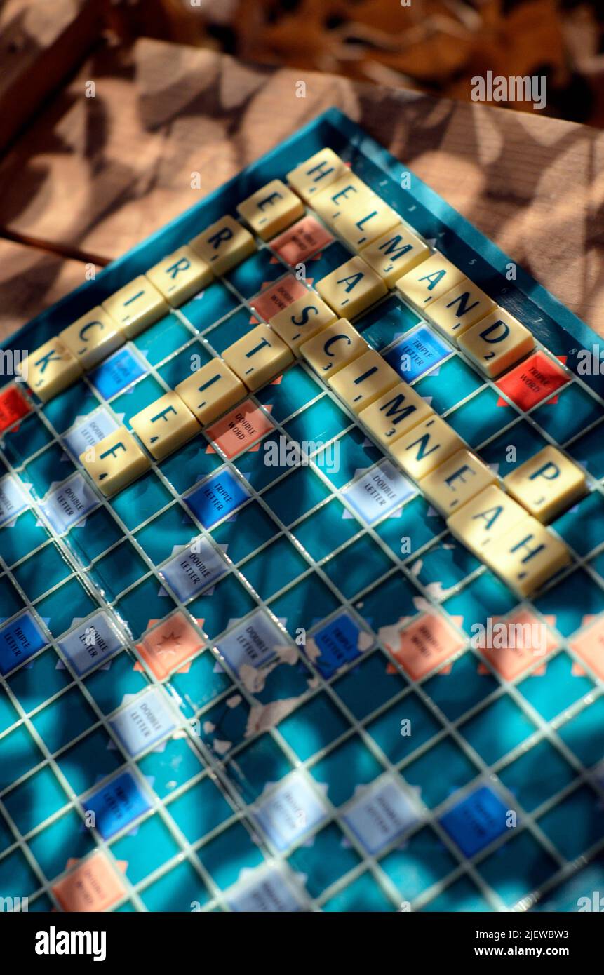 scrabble board with military references and militaria behind Stock Photo - Alamy