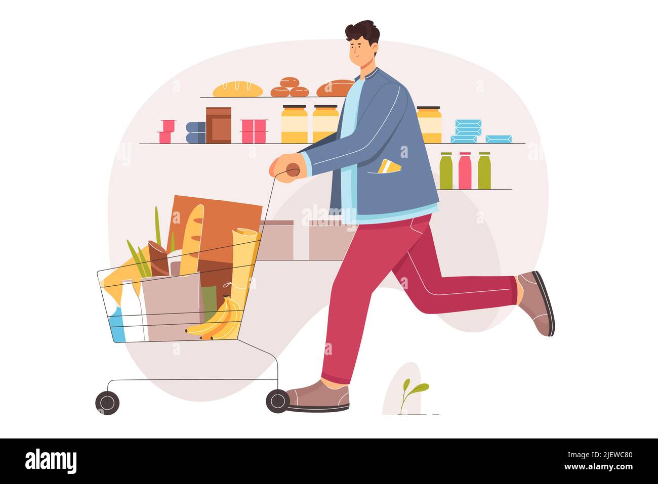 Consumer pushing shopping trolley full of grocery products in ...