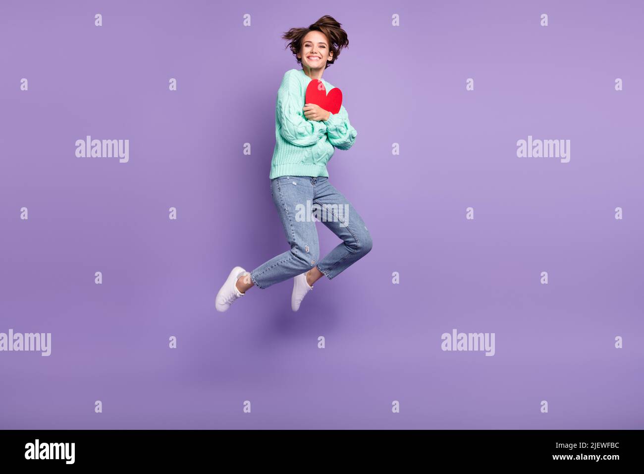 Full length body size view of attractive cheerful amorous girl jumping ...