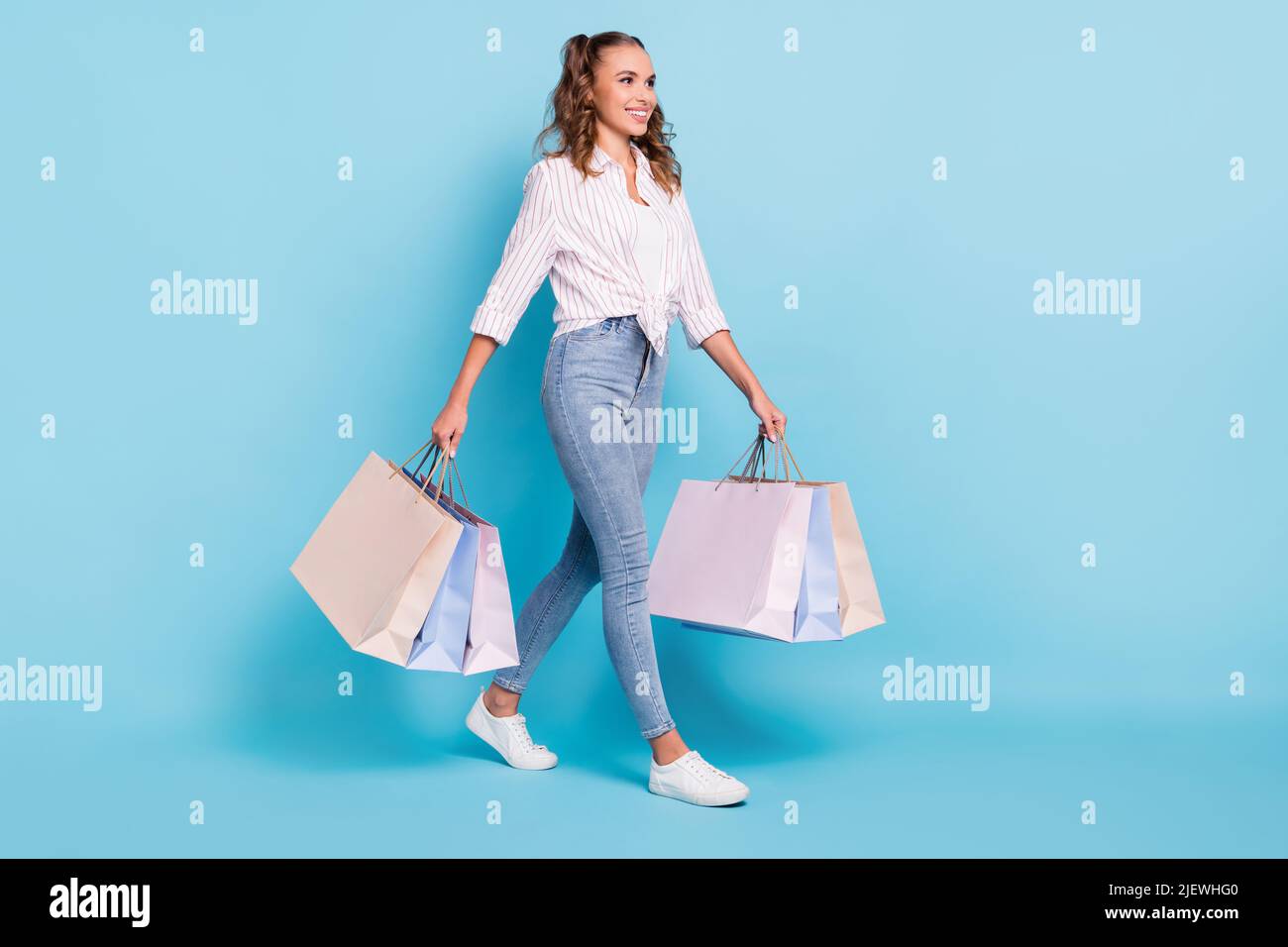 Full length body size photo of girl keeping packages after sale ...
