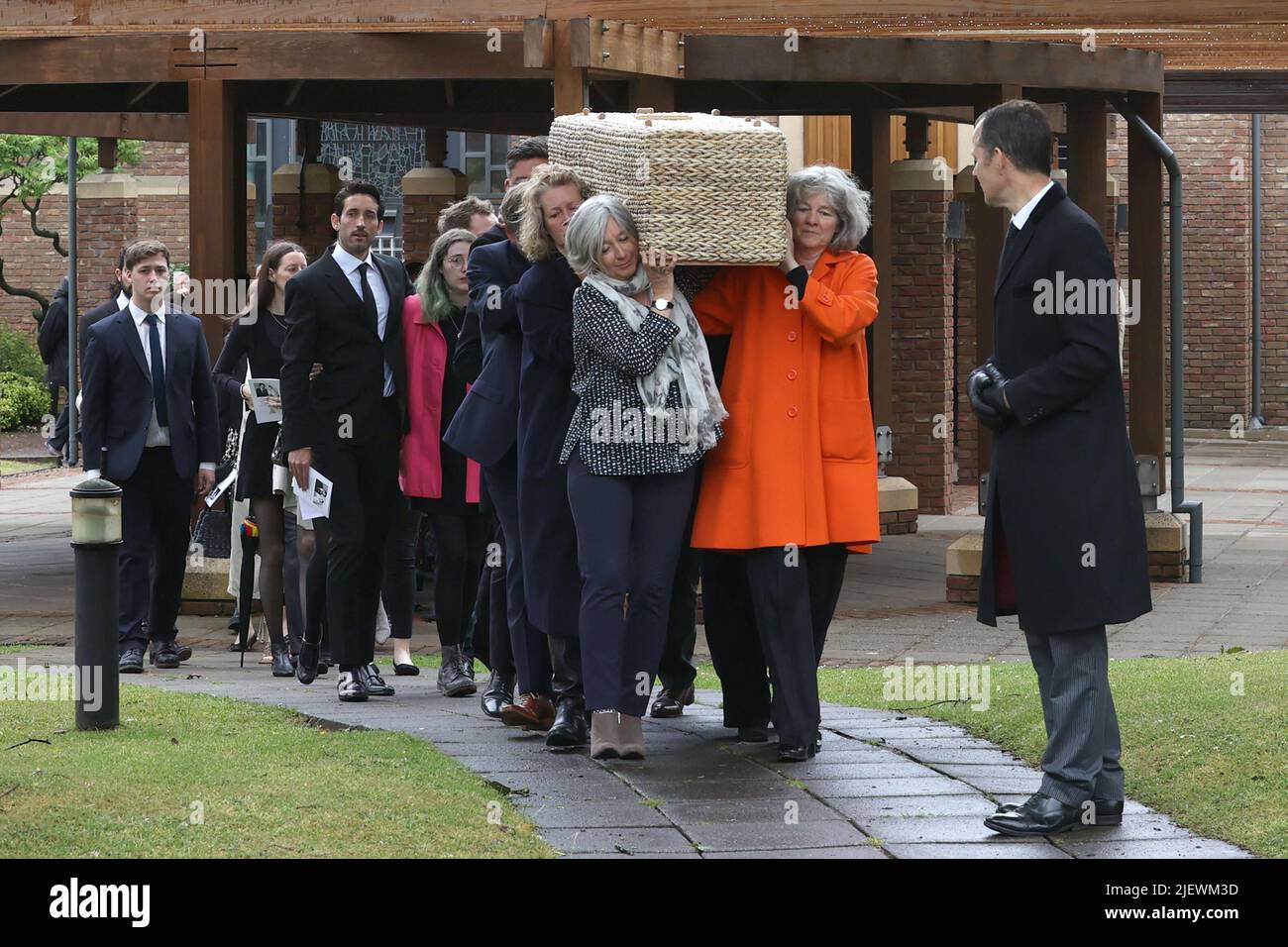 Mourners carry the coffin of James Fitzpatrick after the funeral of the ...