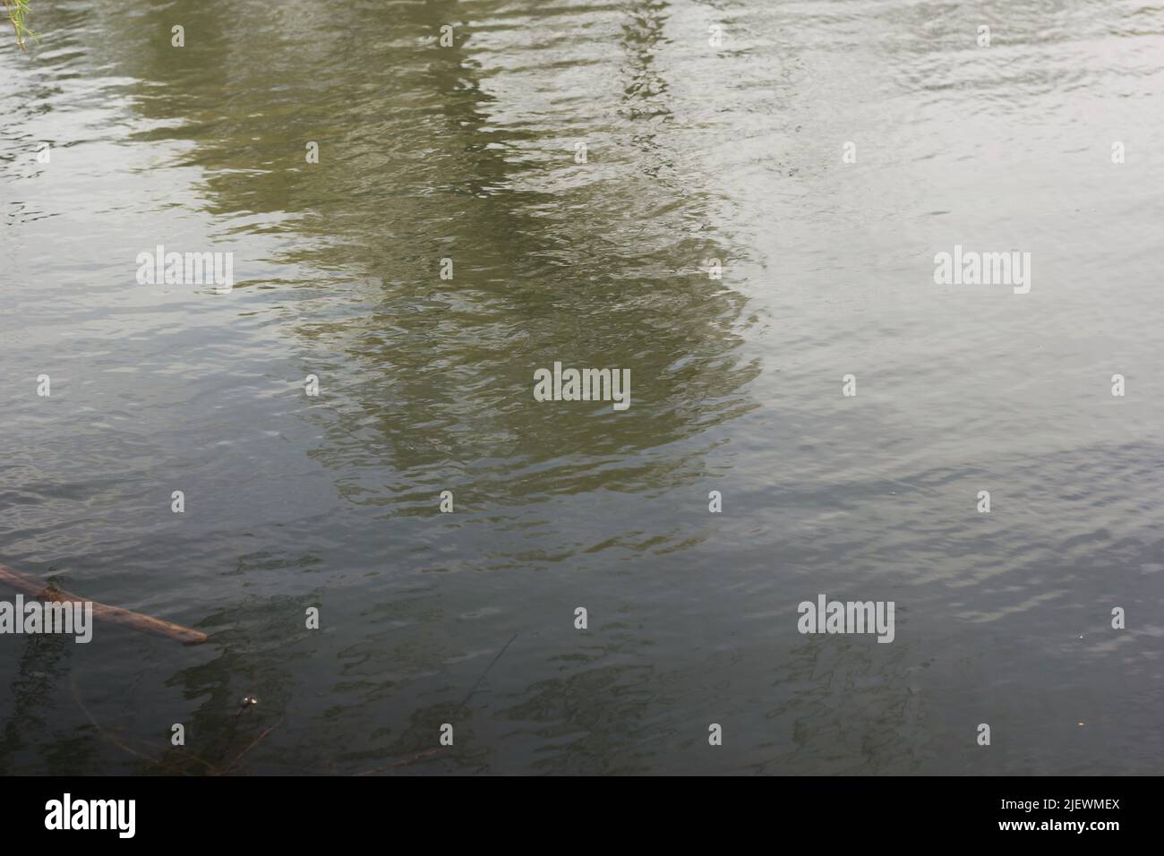 Waves and ripples wandering thru the surface of the water Stock Photo ...