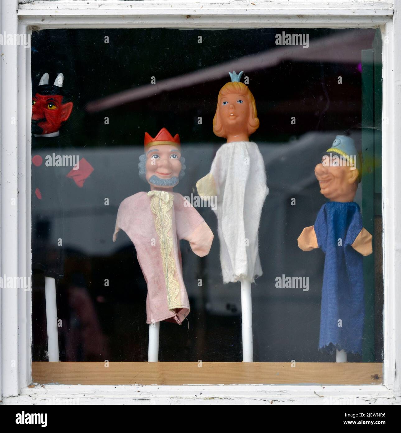 puppets on sticks in cottage window ravenningham norfolk england Stock ...