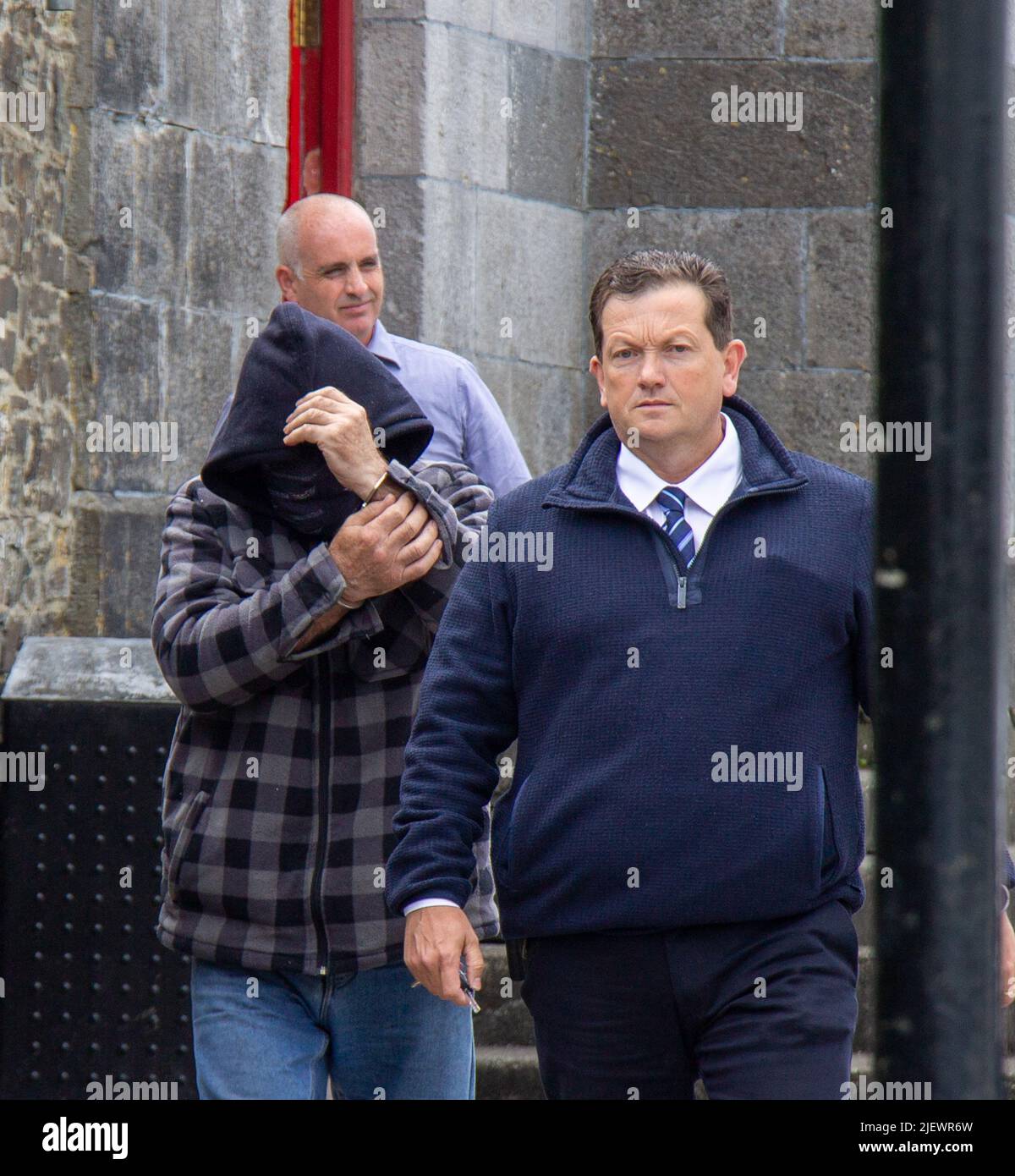 Man led away in handcuffs hi-res stock photography and images - Alamy