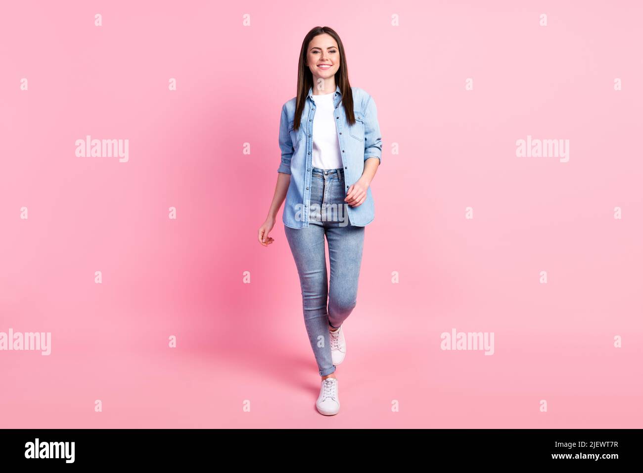 Full body photo of cheerful nice young woman walk smile wear denim ...
