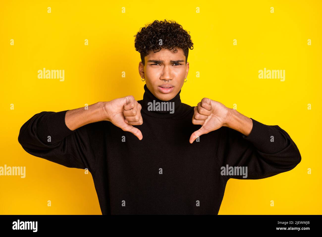 Photo of attractive upset dark skin man wear black sweater showing ...