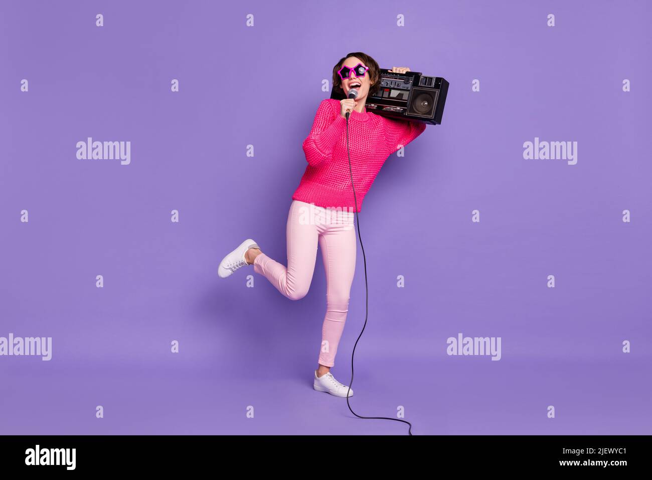 Full length photo of young girl happy smile sing microphone hold ...
