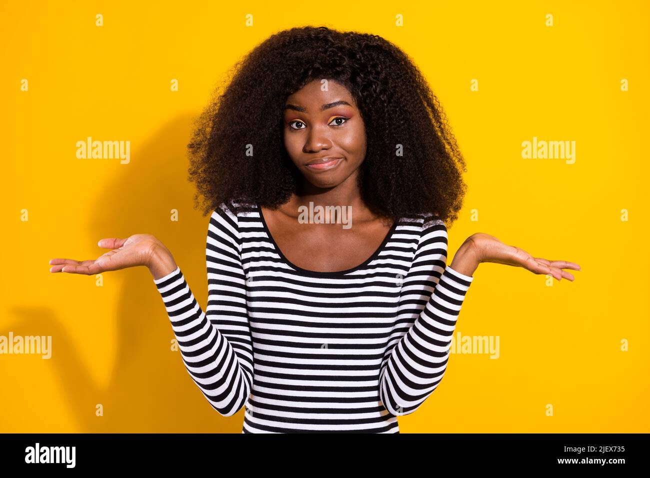 Photo portrait of curly girl shrugging shoulders isolated vibrant ...