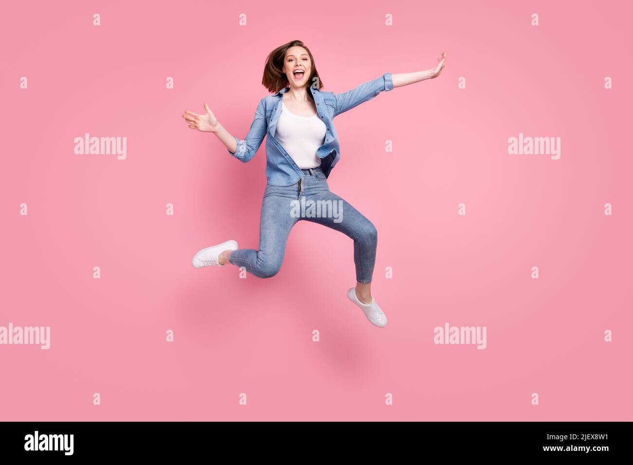 Full length body size photo girl laughing careless jumping high in ...